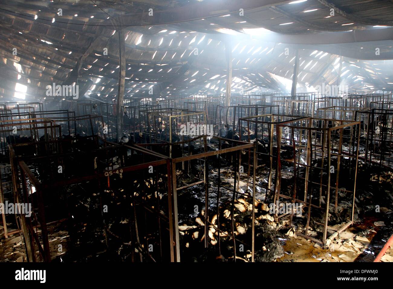 Burned machines are seen in a factory hall after a devastating fire at ...