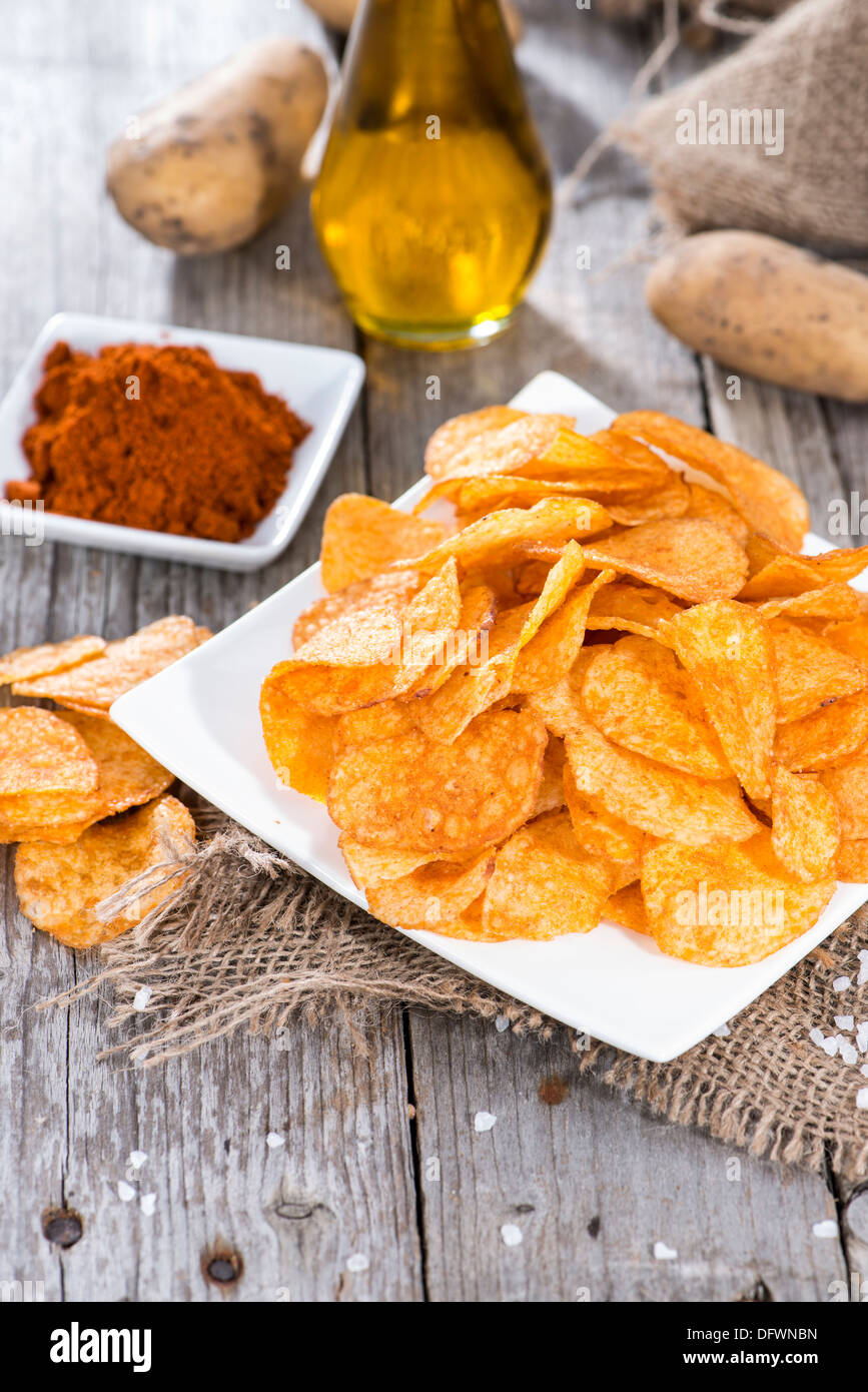 Heap of paprika potato chips on rustic hi-res stock photography and ...