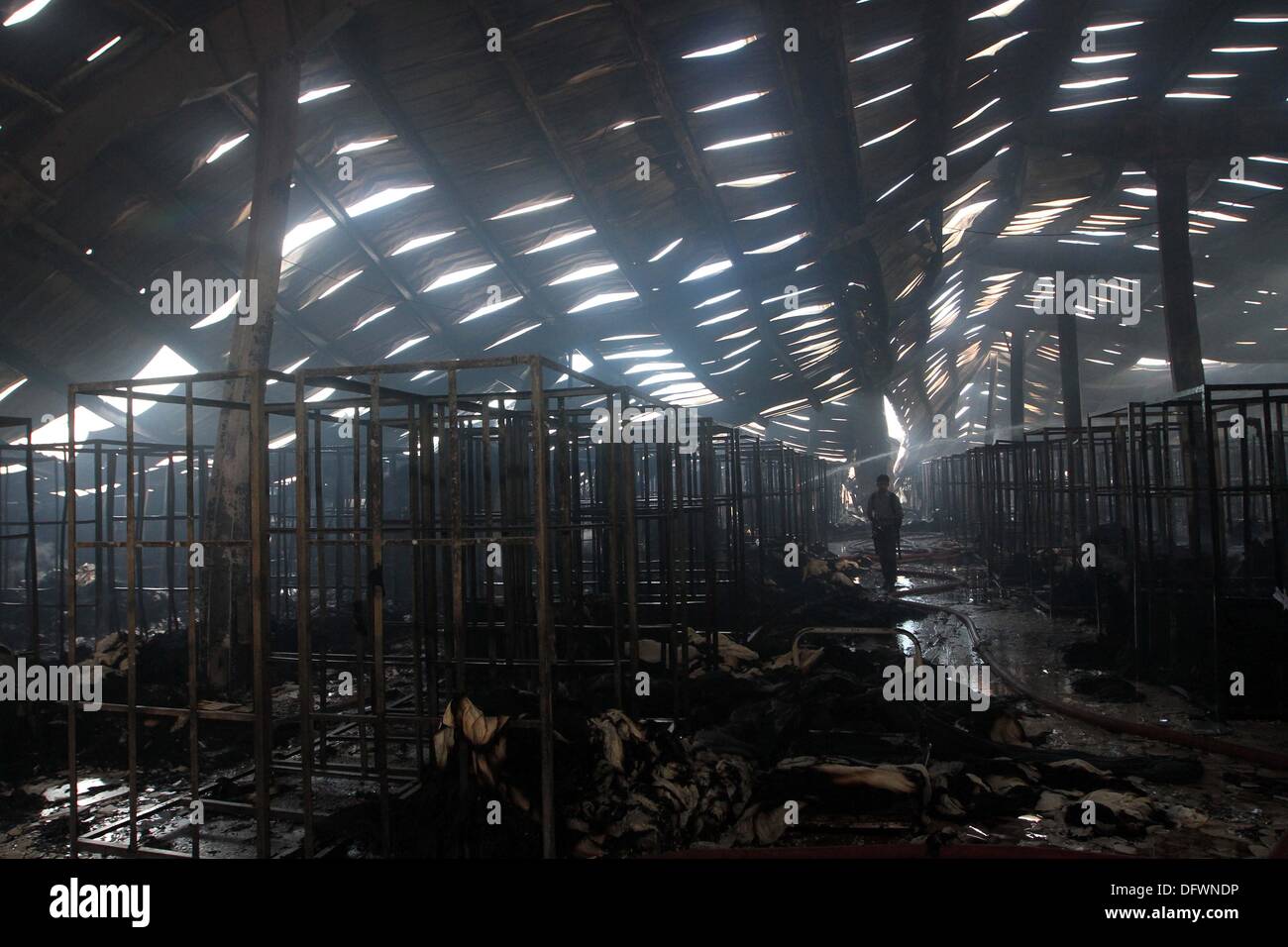 Burned machines are seen in a factory hall after a devastating fire at ...