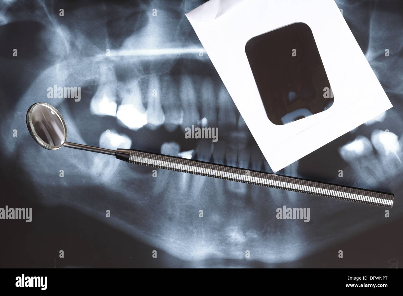 Panoramic x-ray image scan of humans teeth and dental mirror Stock ...