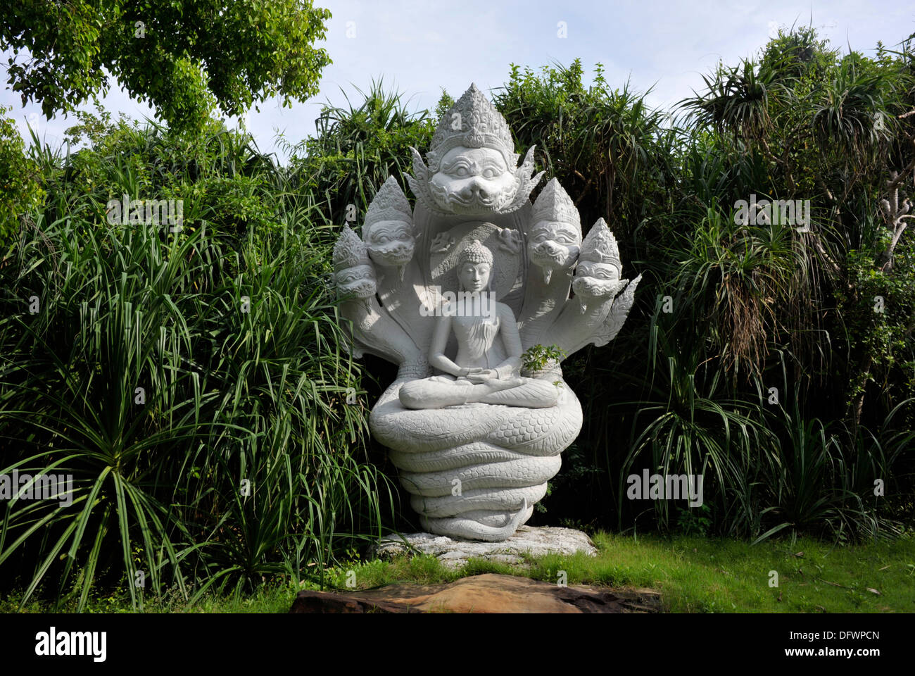 Statue depicting Lord Buddha under the protection of a seven headed ...