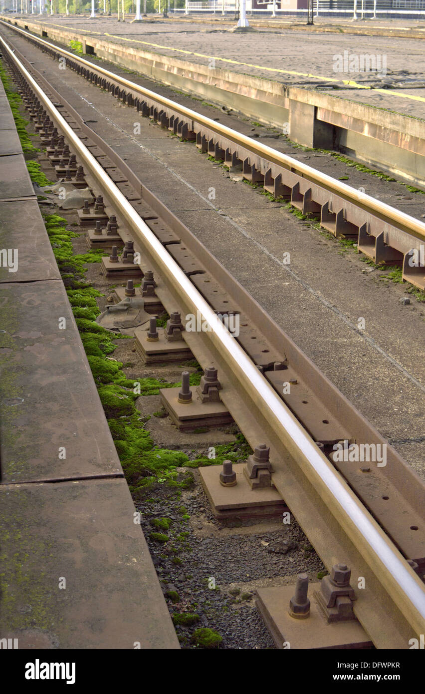 Railway tracks in front of the station Stock Photo - Alamy