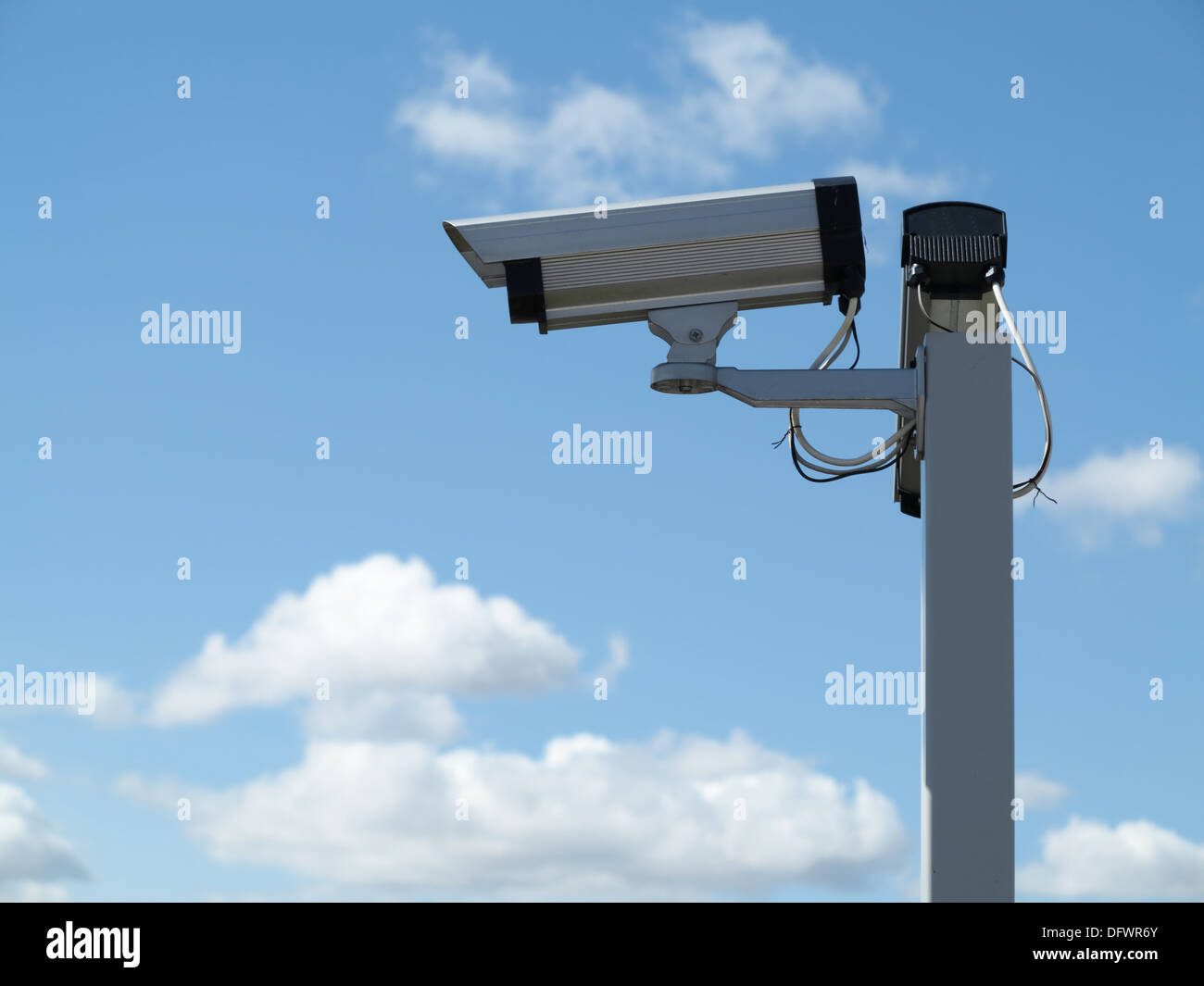 Security camera CCTV video surveillance over blue sky Stock Photo - Alamy