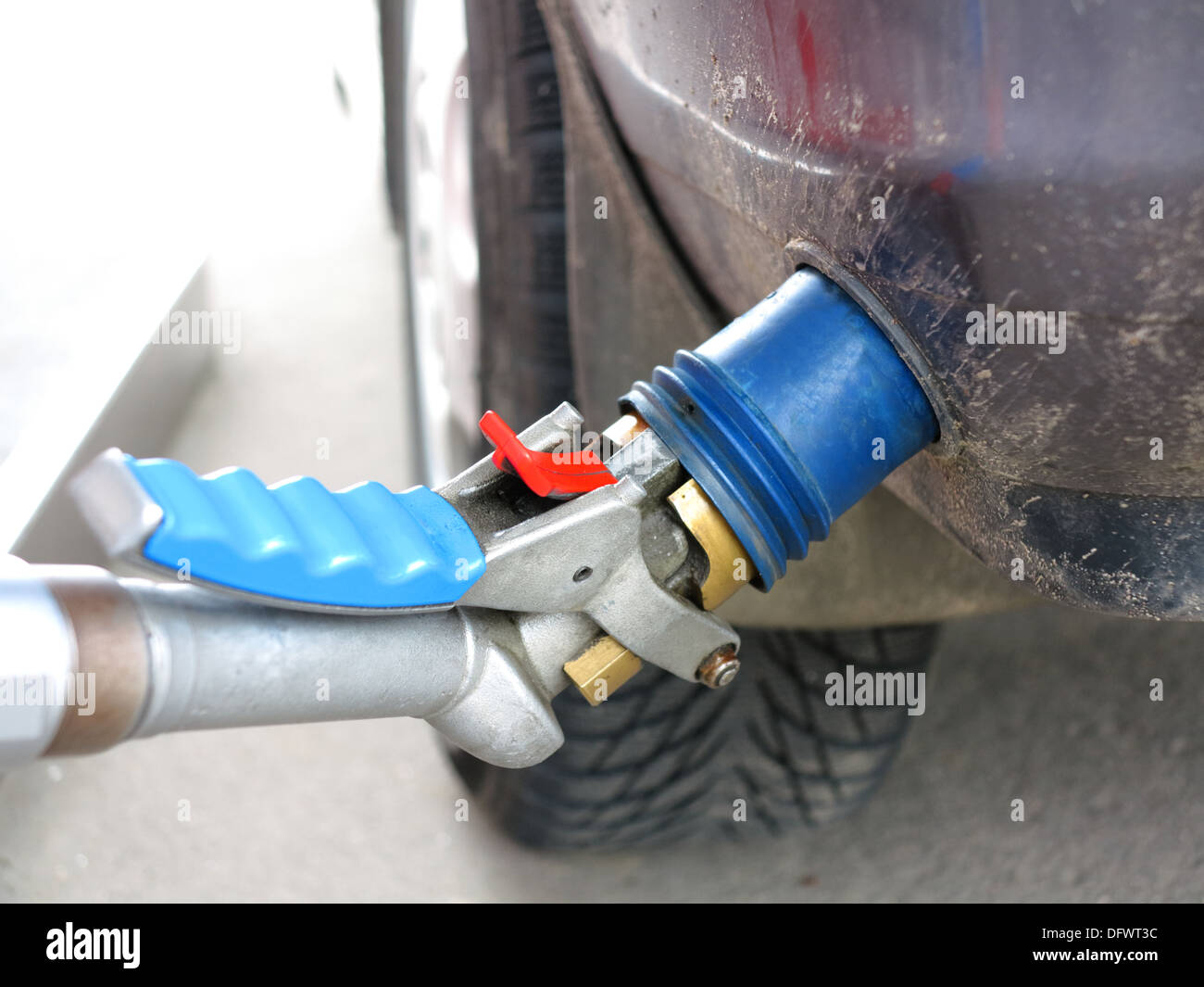 car at gas station being filled with fuel Stock Photo - Alamy