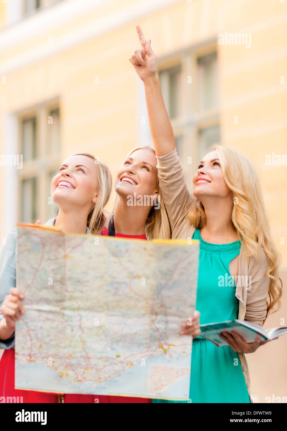 beautiful women with tourist map in the city Stock Photo - Alamy