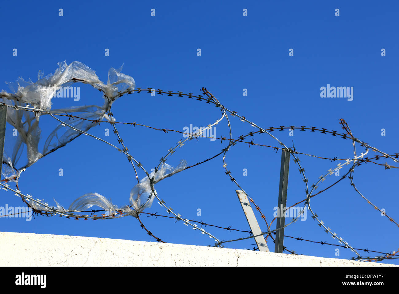 Barbed wire on wall hi-res stock photography and images - Alamy