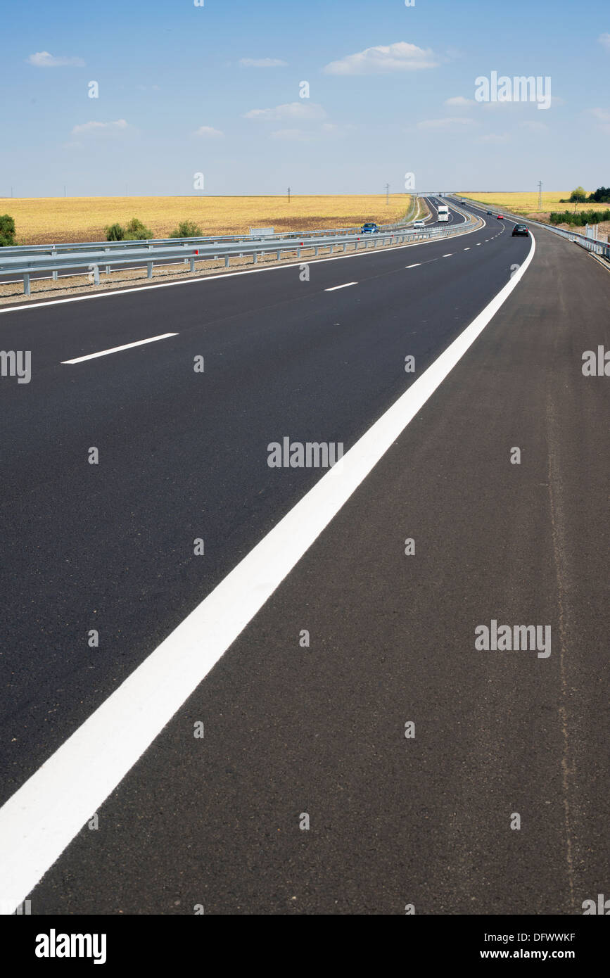 New Highway road. White line and blue sky Stock Photo - Alamy