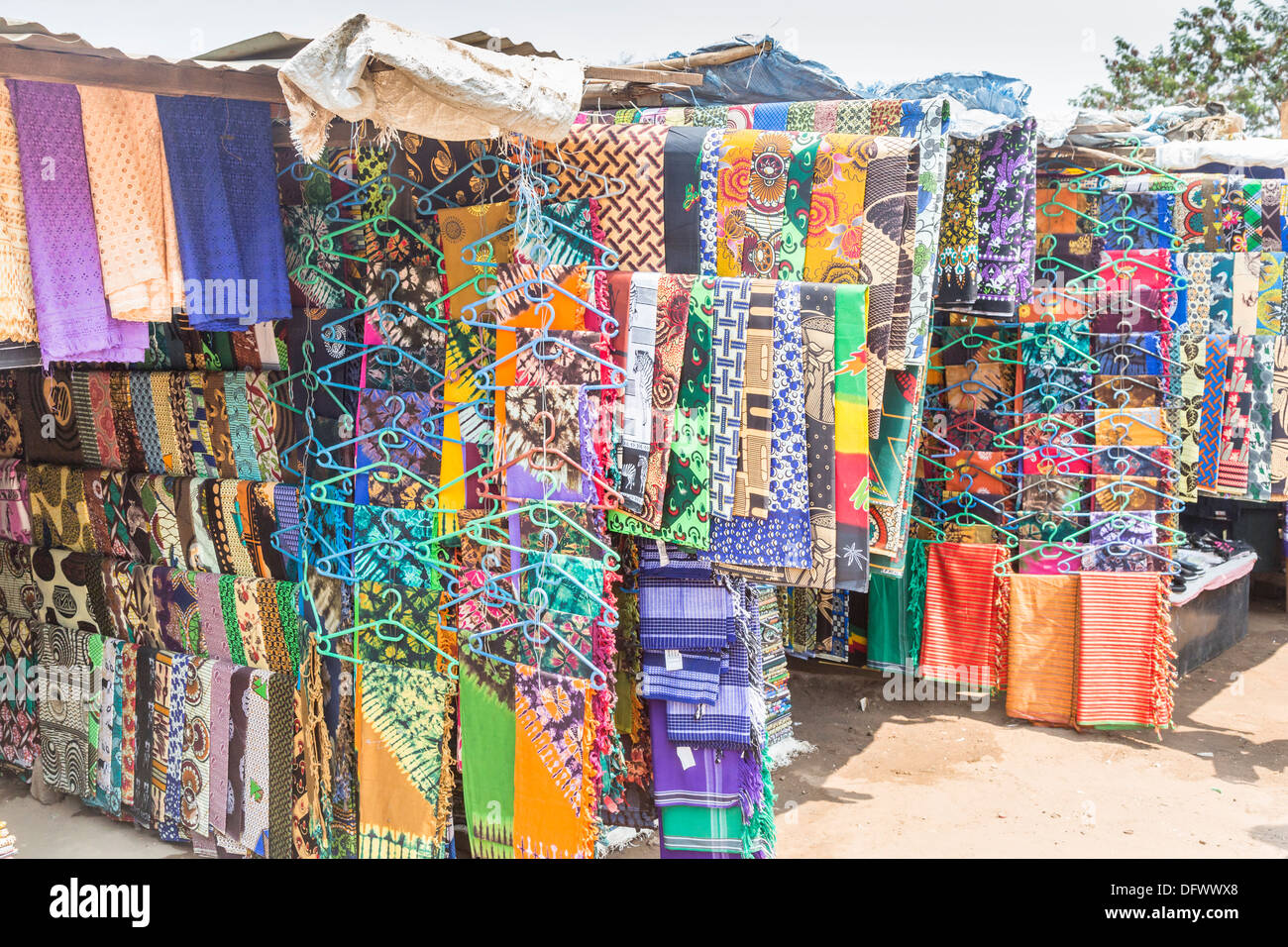 Colourful and brightly coloured fabrics and materials displayed in a ...