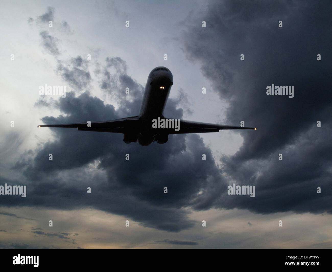 Passernger Airplane Against Dramatic Sky, Low Angle View Stock Photo ...