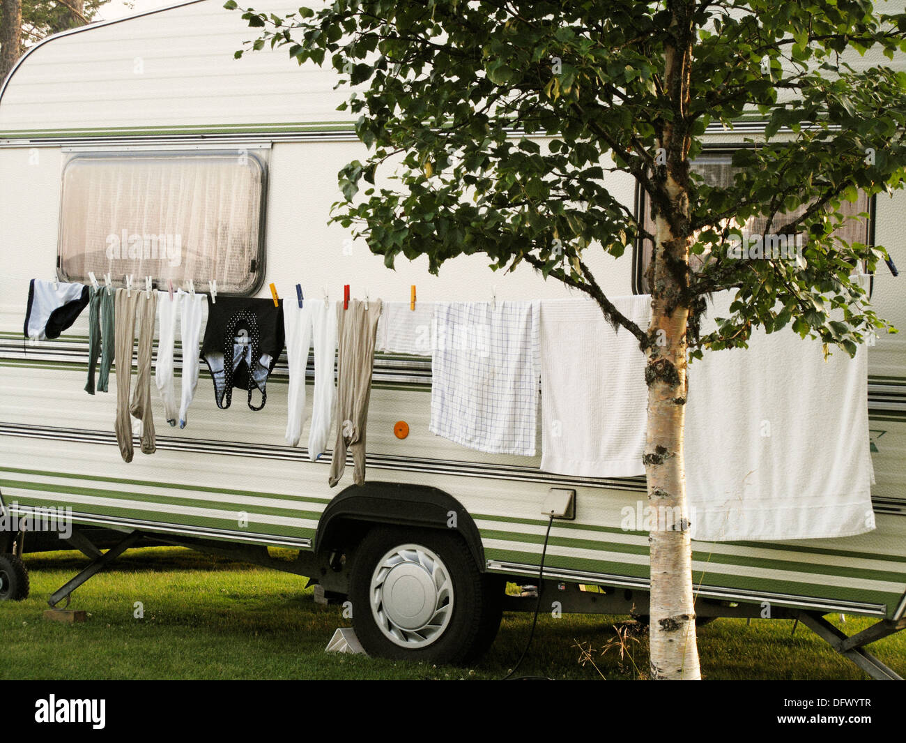 Laundry Drying on Clothesline Near Camping Trailer Stock Photo - Alamy