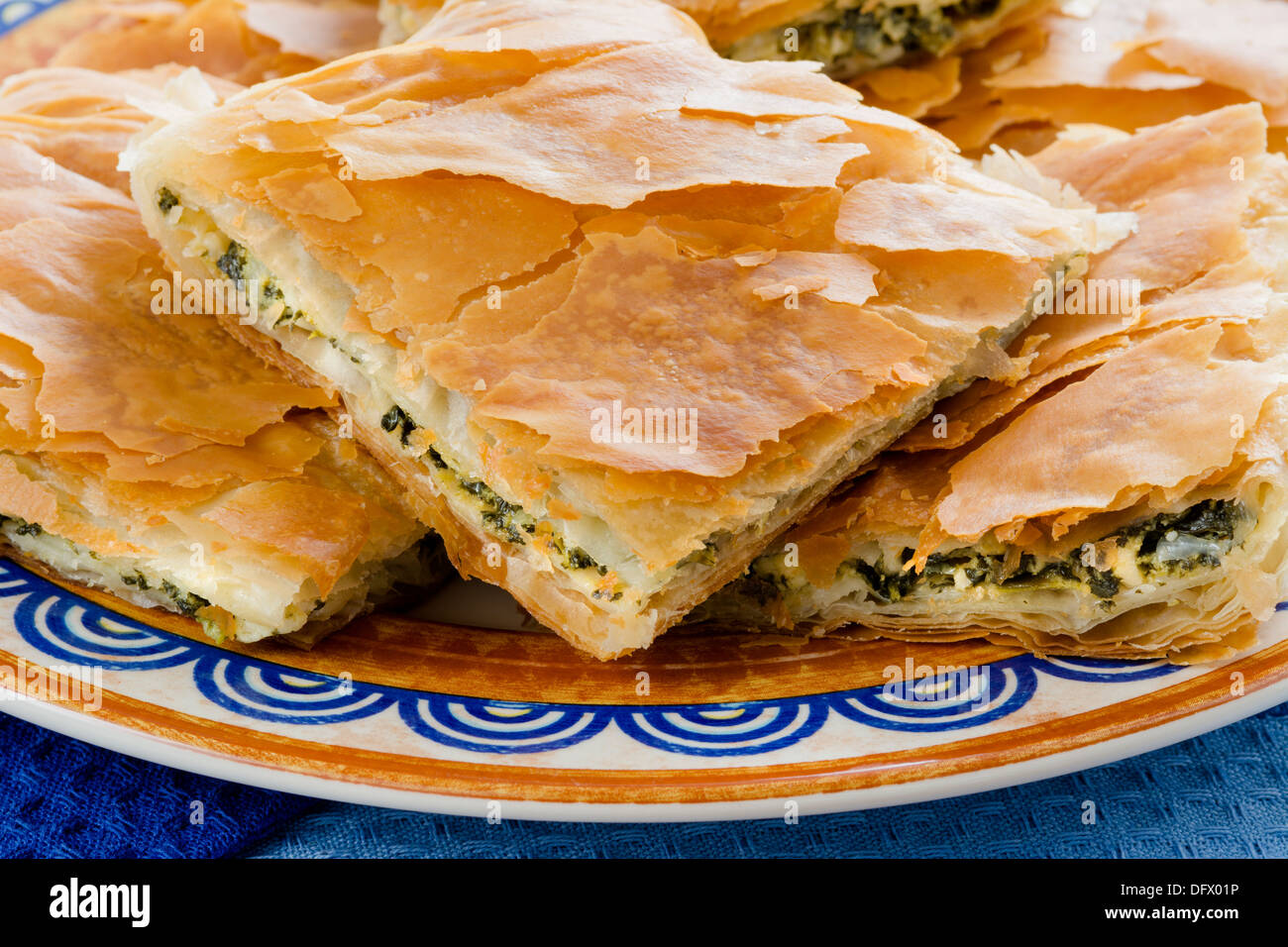 Spanakopita, Greek spinach pie with feta cheese and filo party on on ...