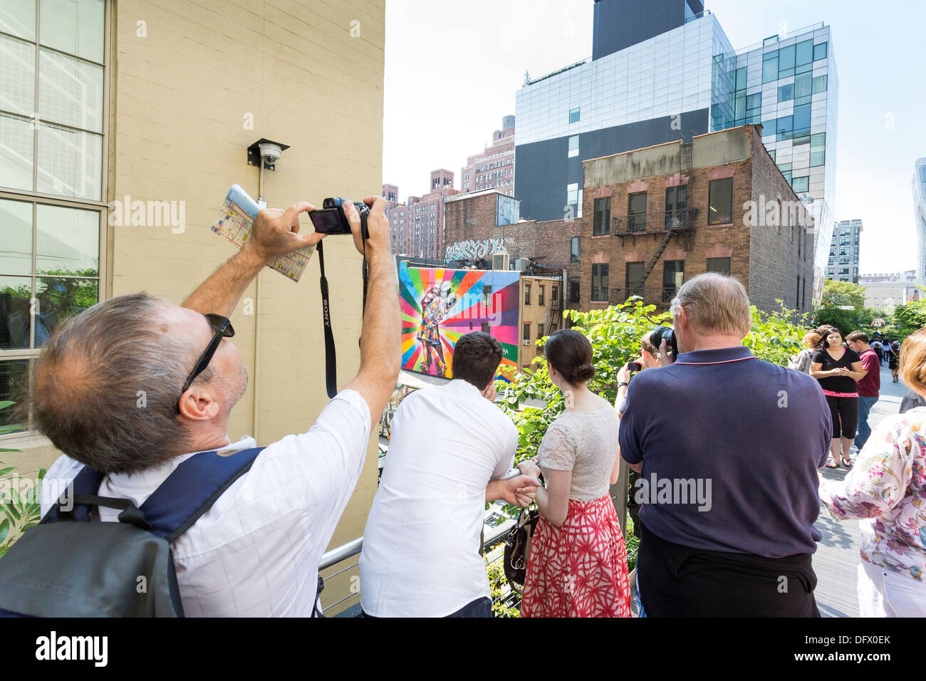 Standing people taking photographs with their cameras Stock Photo - Alamy