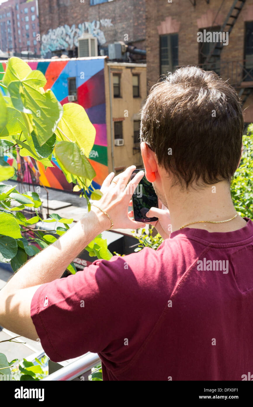 Back view man taking photograph hi-res stock photography and images - Alamy