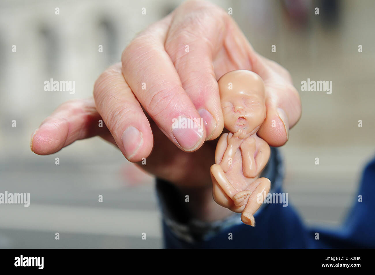 London UK, 9th Oct 2013 : Activist from Abort67 holding plastic replica ...