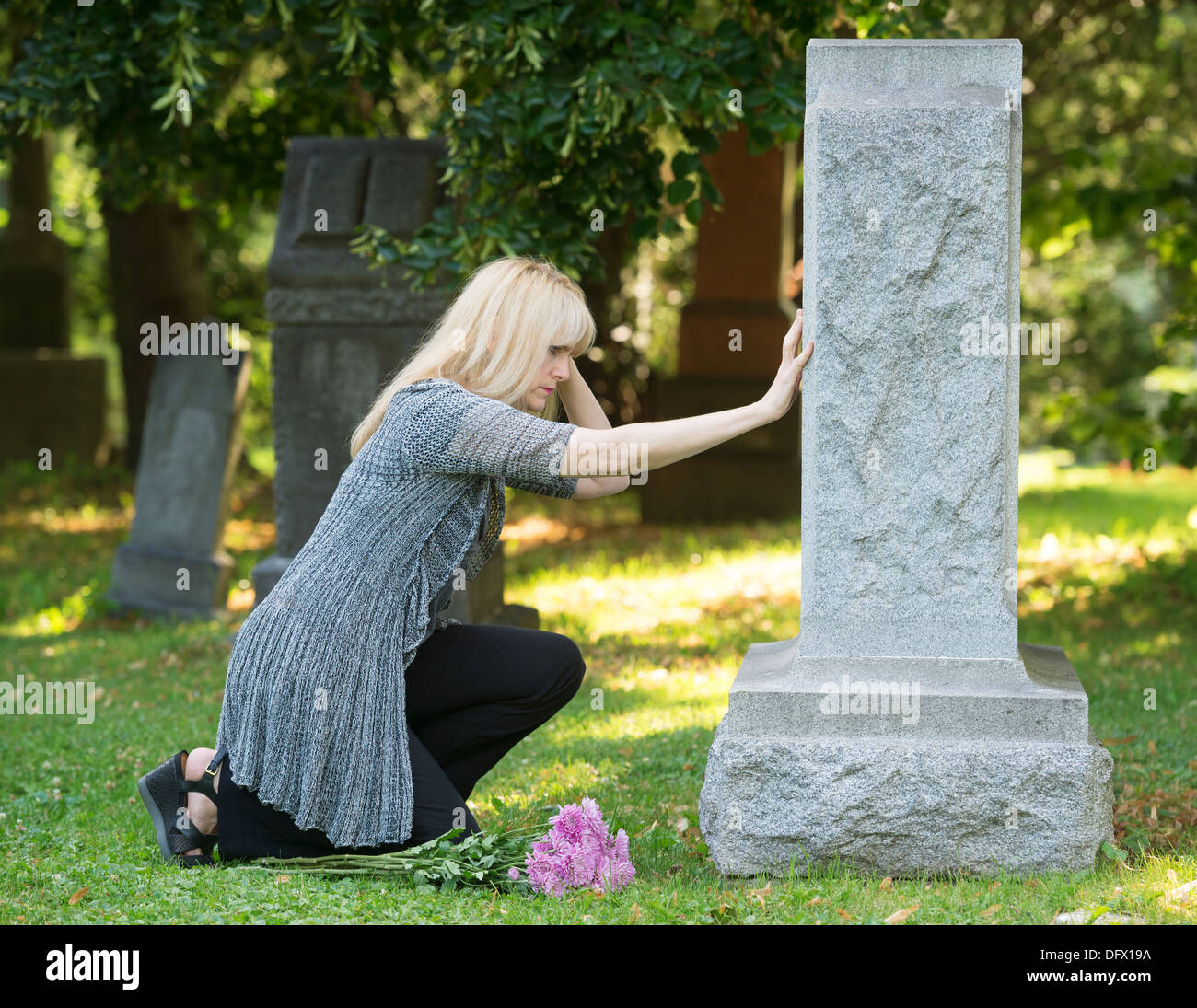 People Crying At A Grave