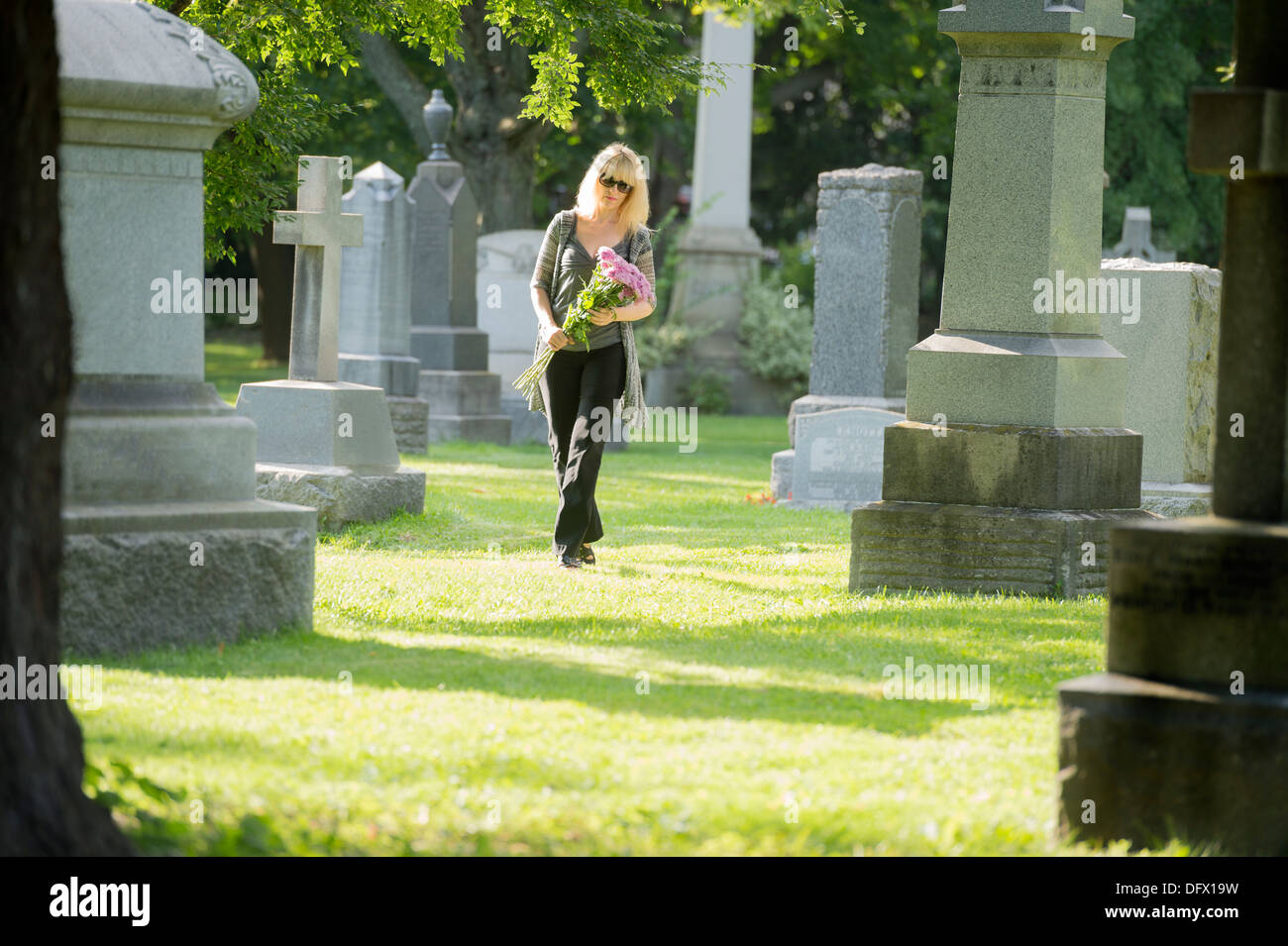 People Crying At A Grave