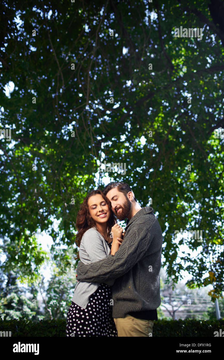 Happy young woman tenderly hugging hi-res stock photography and images ...