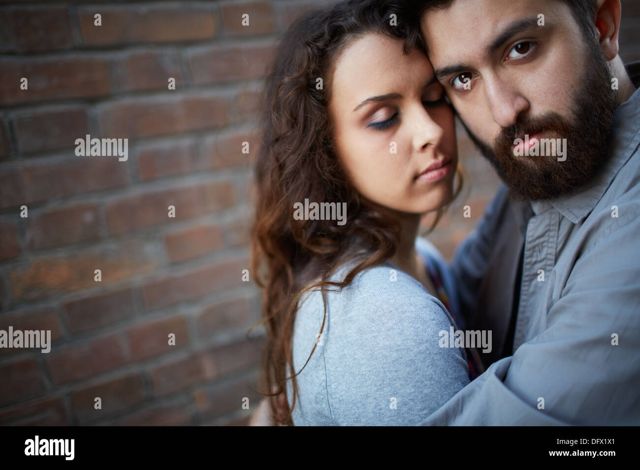 Portrait of affectionate female in her sweetheart embrace Stock Photo ...