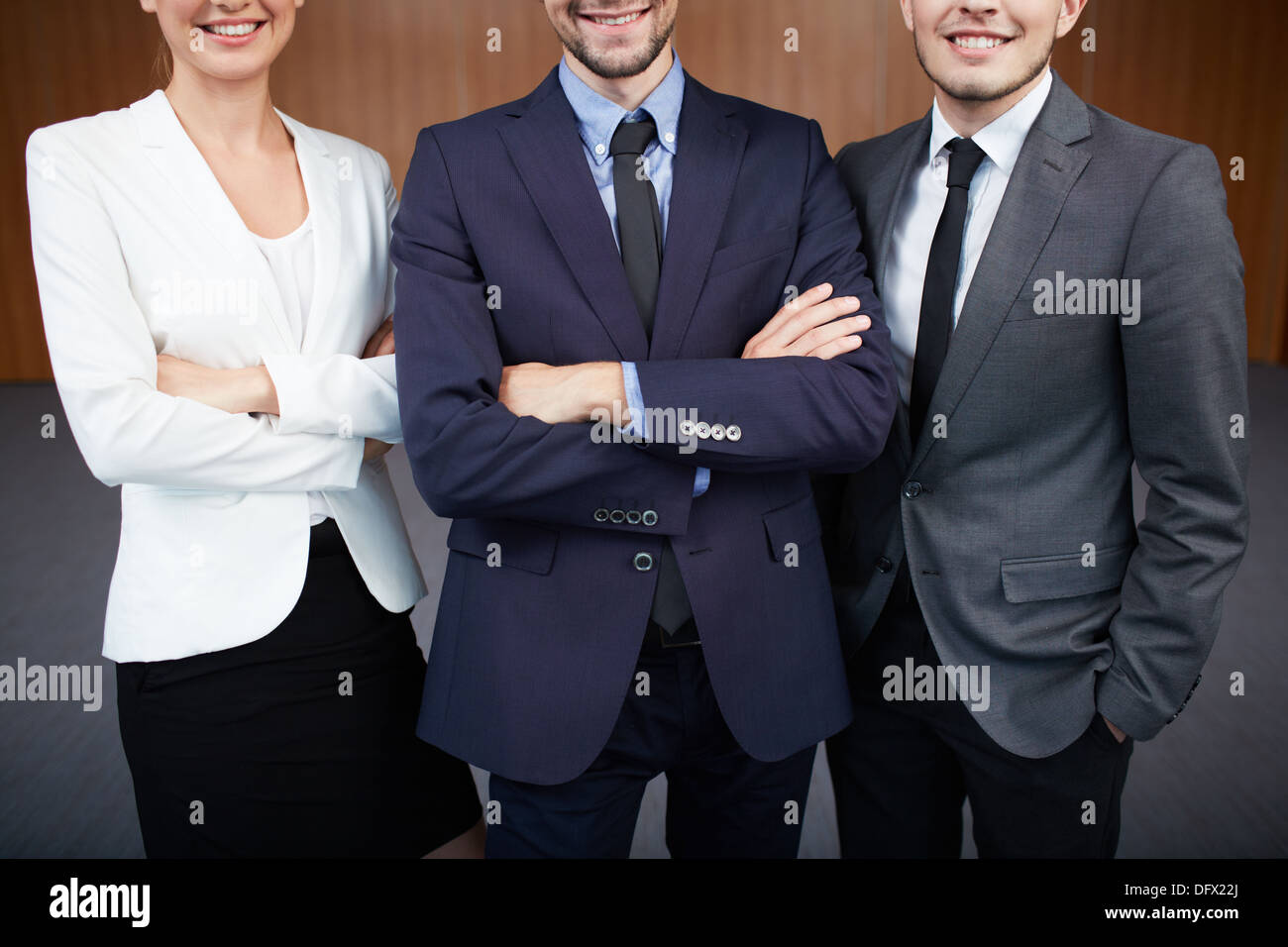 Group of smiling business partners in suits Stock Photo - Alamy