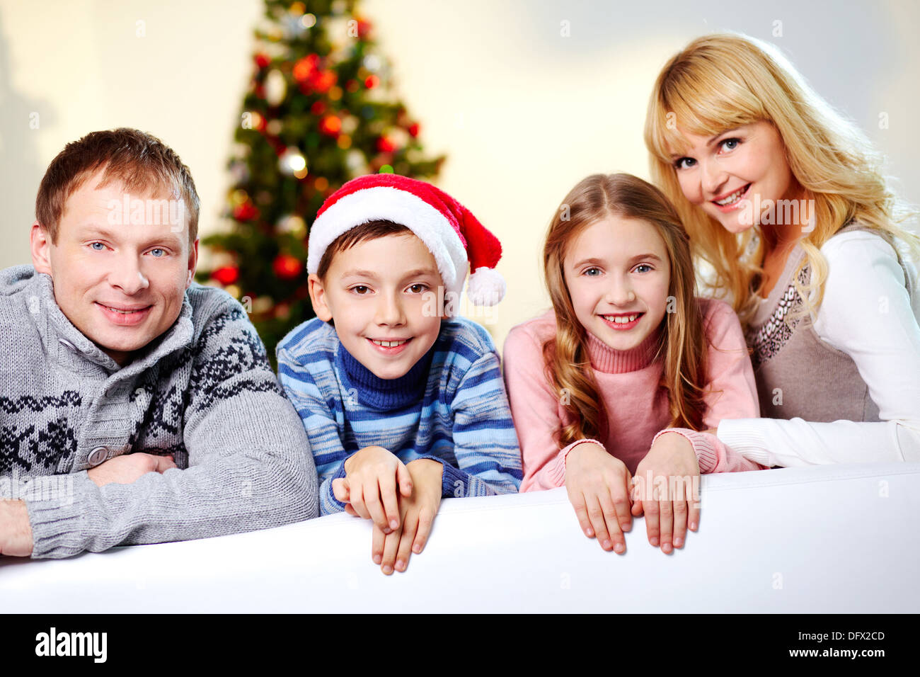 Portrait four happy family members hi-res stock photography and images ...