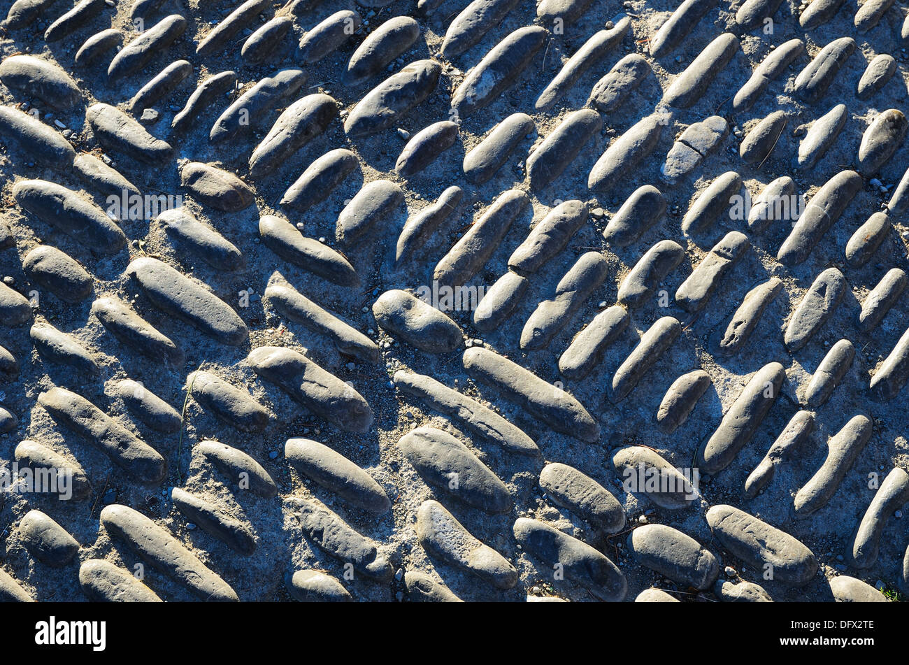Pebbly pavement of the ancient road Stock Photo - Alamy