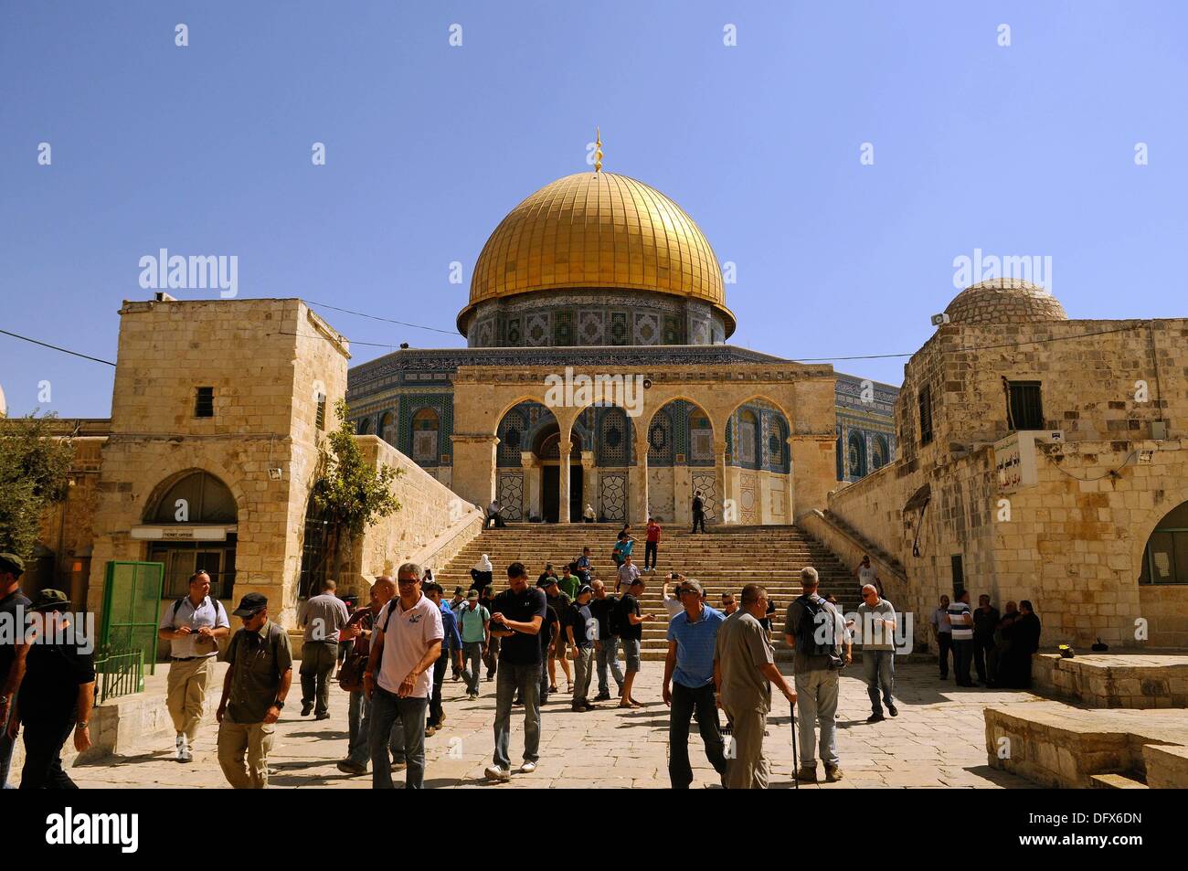 A tourist group leaves the area of the Dome of the Rock on the Temple ...