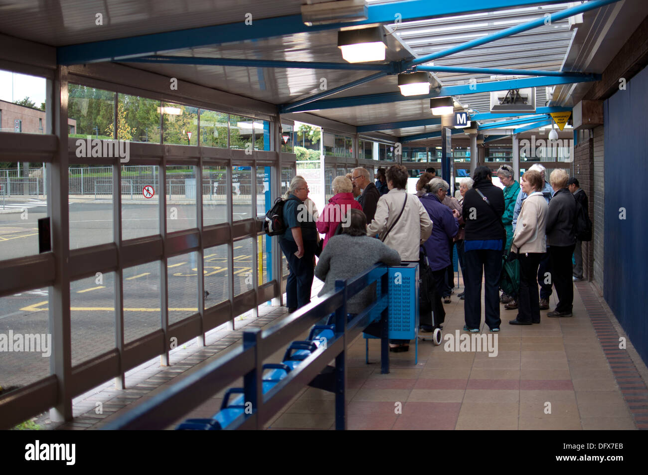 People waiting at Pool Meadow bus station, Coventry, UK Stock Photo - Alamy