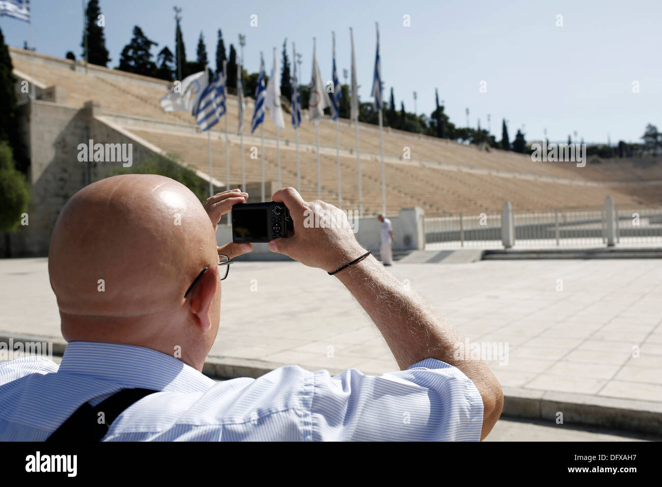 Tourist photographing the Panathenaic (Kallimarmaro) Stadium. Athens ...