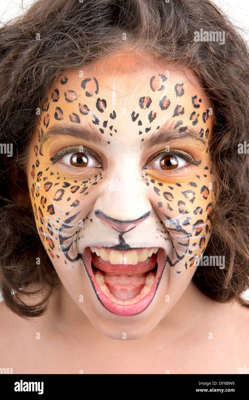 Beautiful young girl with face painted like a leopard Stock Photo - Alamy