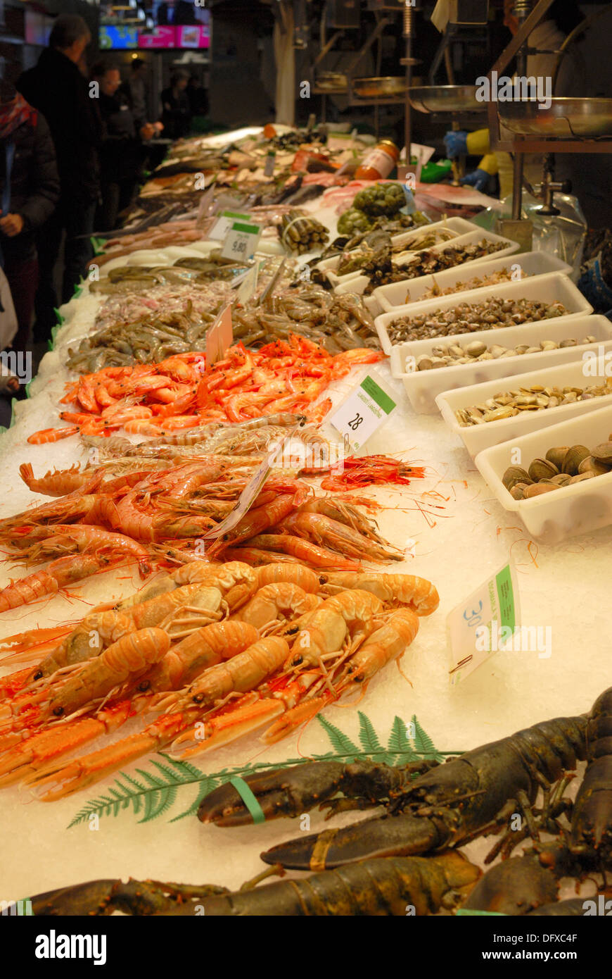 Fishmonger shop in indoor market La Boqueria on Las Ramblas. Barcelona ...