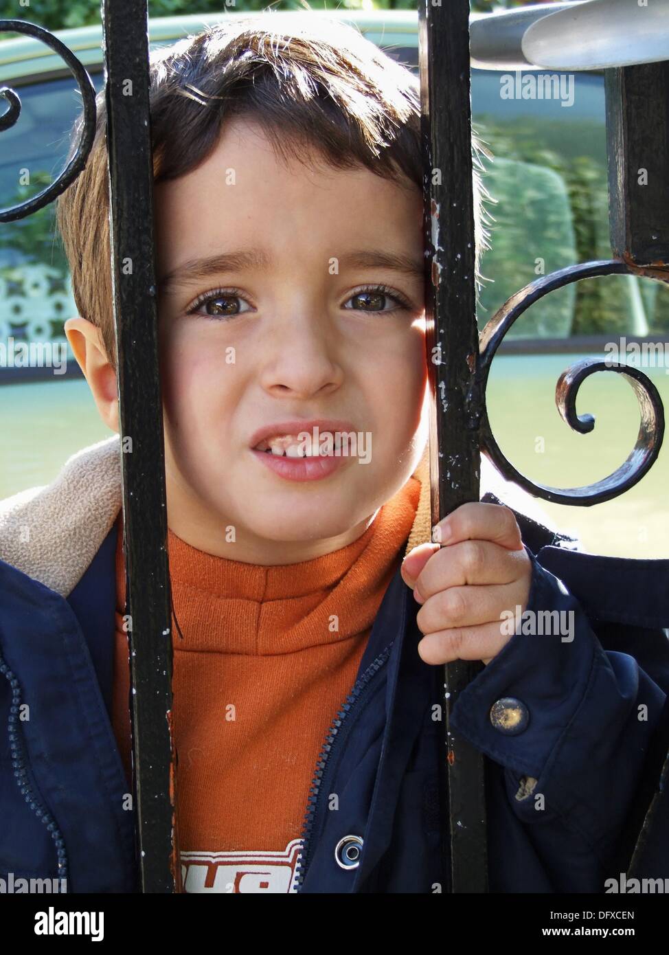 Child leaning over railing hi-res stock photography and images - Alamy