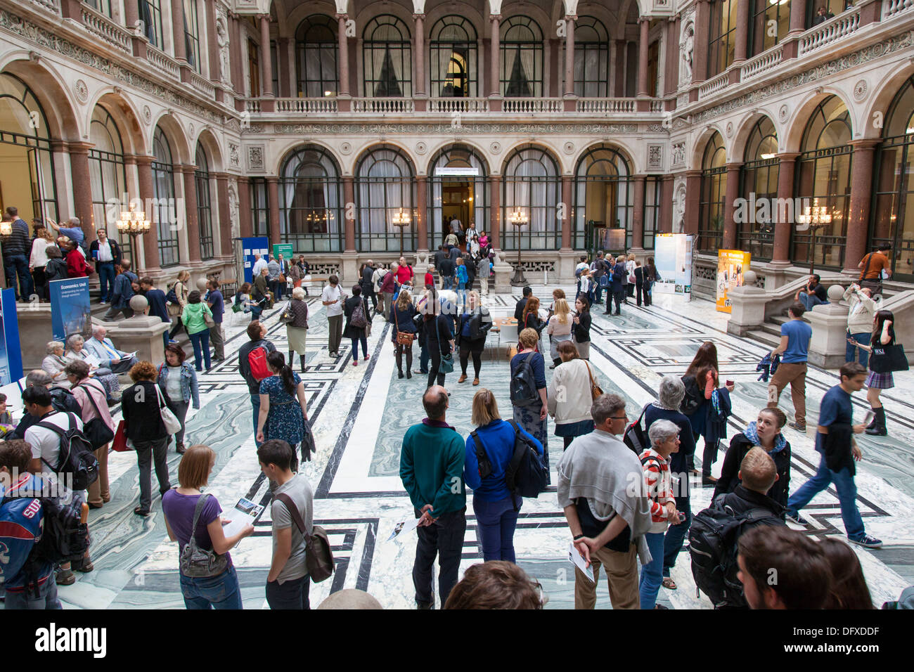 Visitors walk around the Durbar Court designed by Matthew Digby Wyatt ...