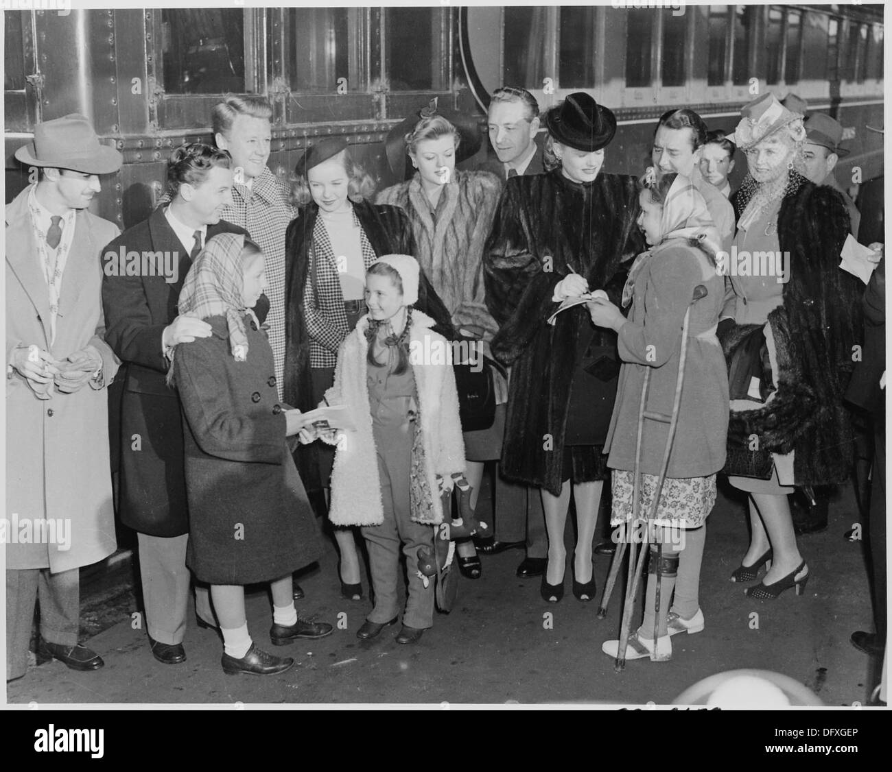Photograph of movie stars signing autographs upon their arrival in ...