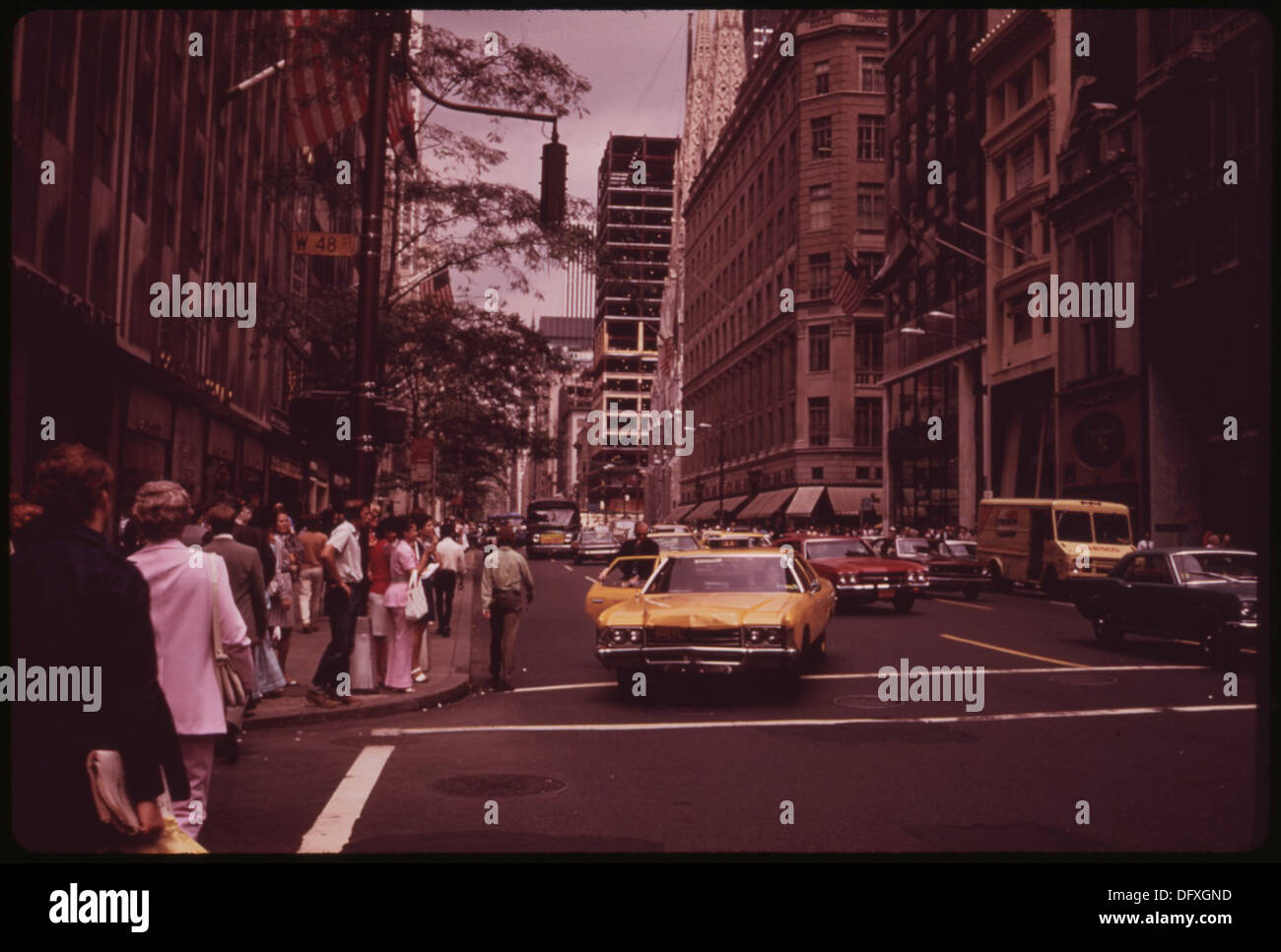 A taxi blocking two lanes at the intersection of 48th Street and Fifth ...