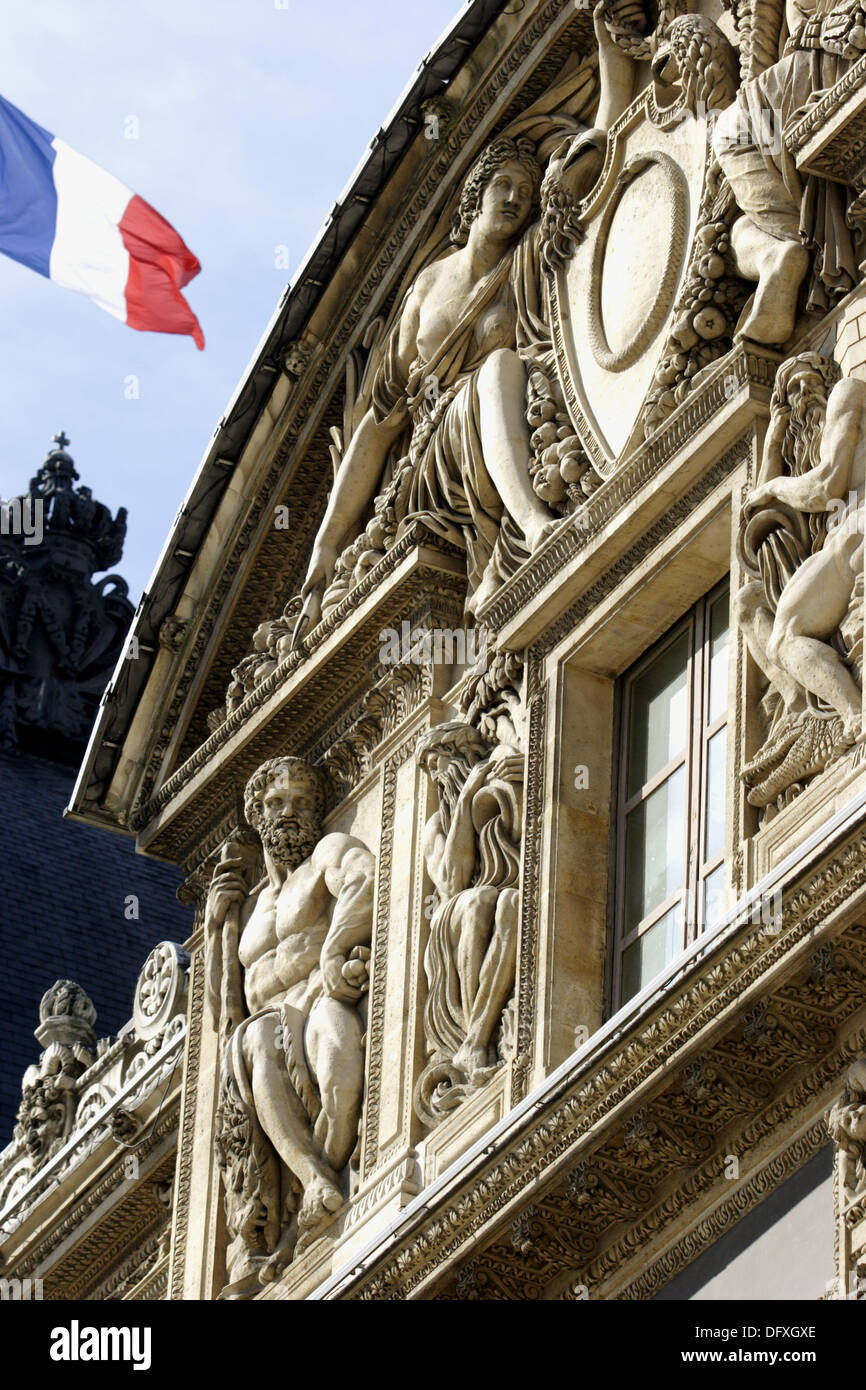 Building decoration on the facade of Sully Wing of Musee du Louvre ...