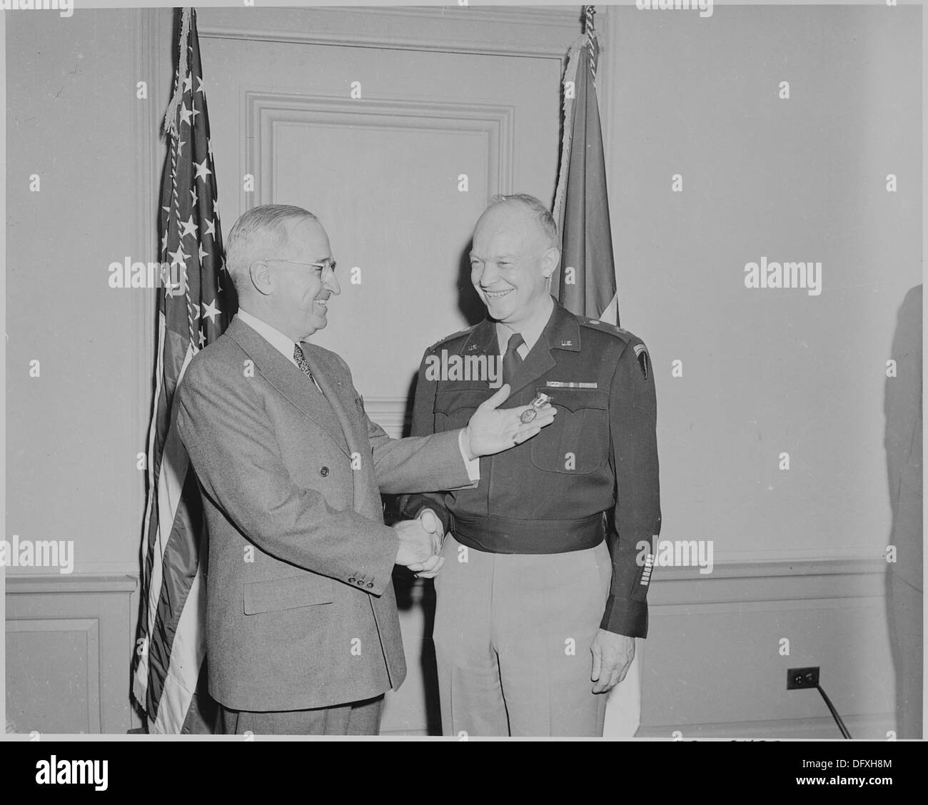 President Harry S. Truman presents General Dwight D. Eisenhower with ...