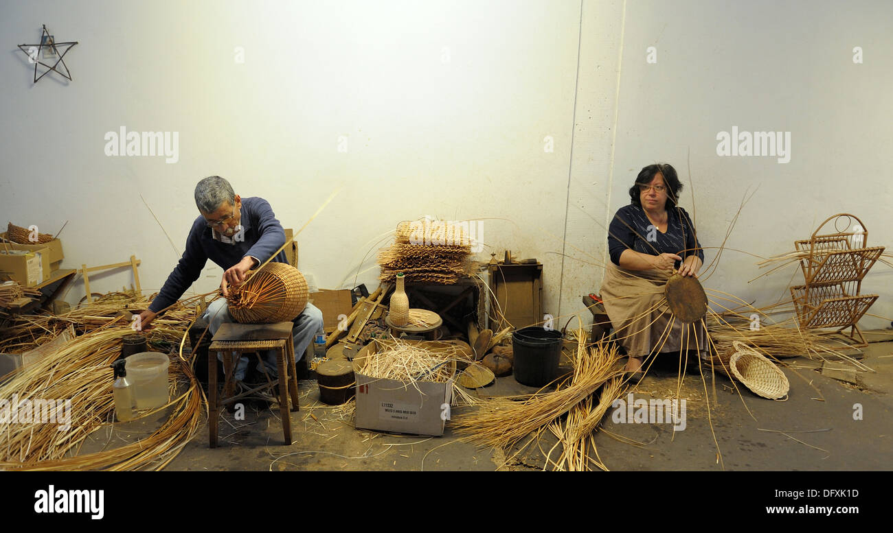 2 Basket weaver at work in the factory shop in Camacha Madeira Portugal ...