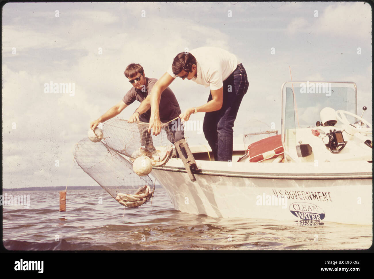 This image shows aquatic biologists from the Southeast Water Laboratory ...