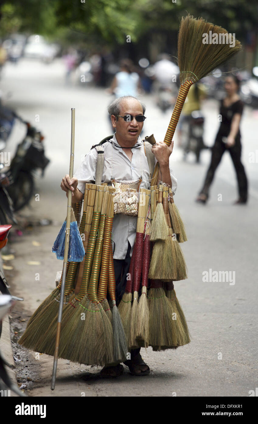 Man carrying broom hi-res stock photography and images - Alamy