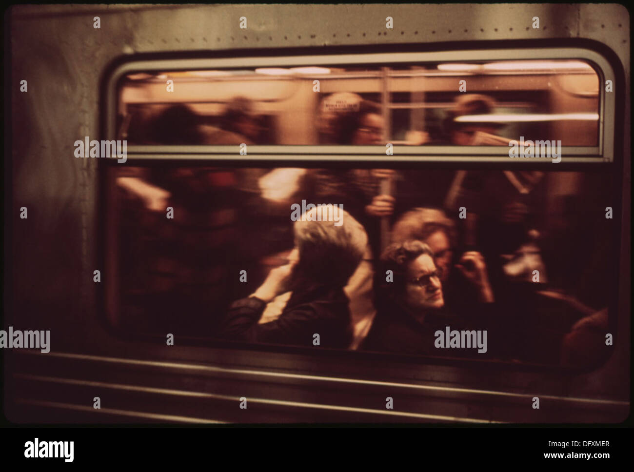 This image shows an interior view of a subway car, capturing the ...