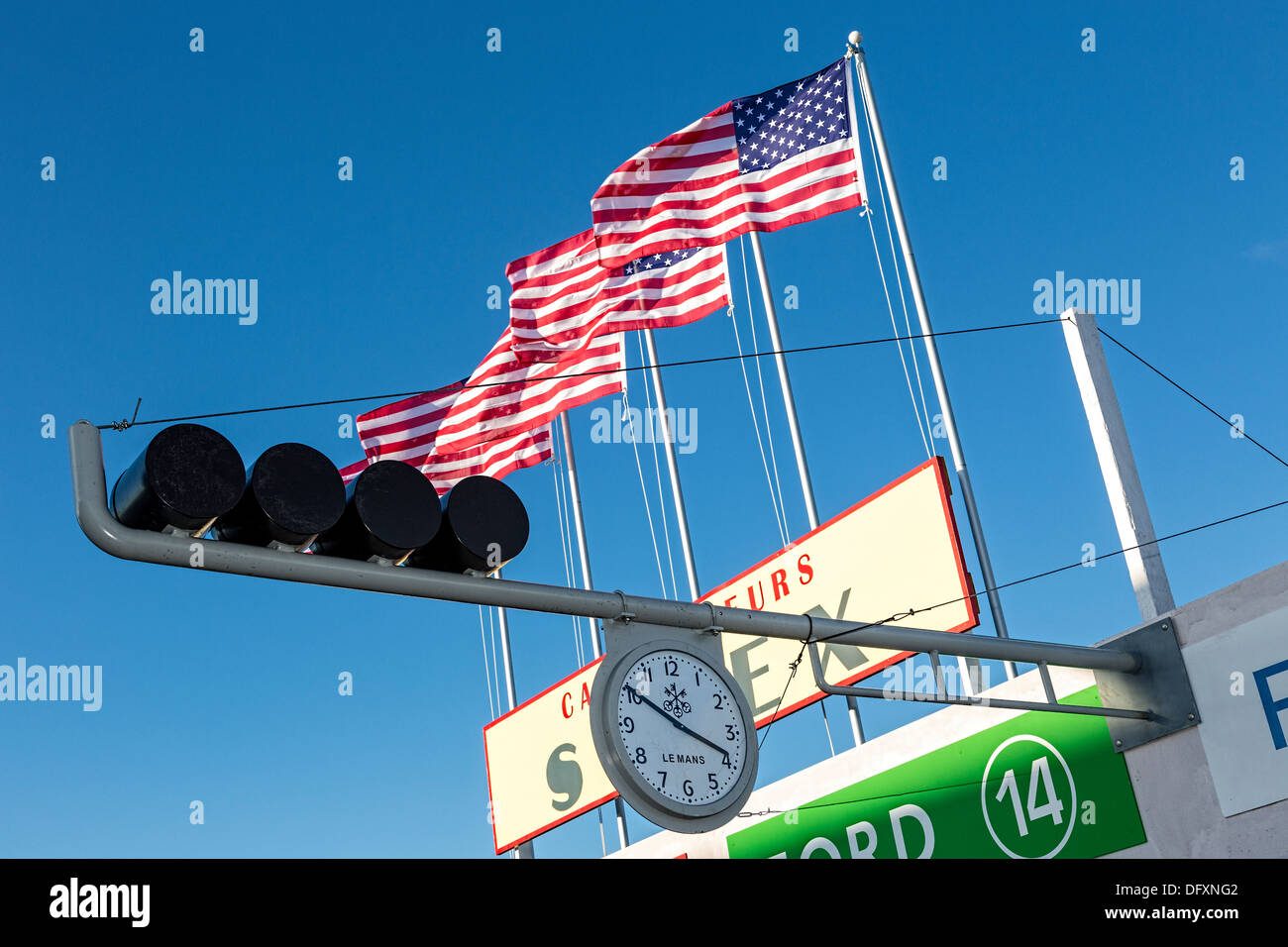 American Stars and Stripes flags above the simulated start line gantry ...