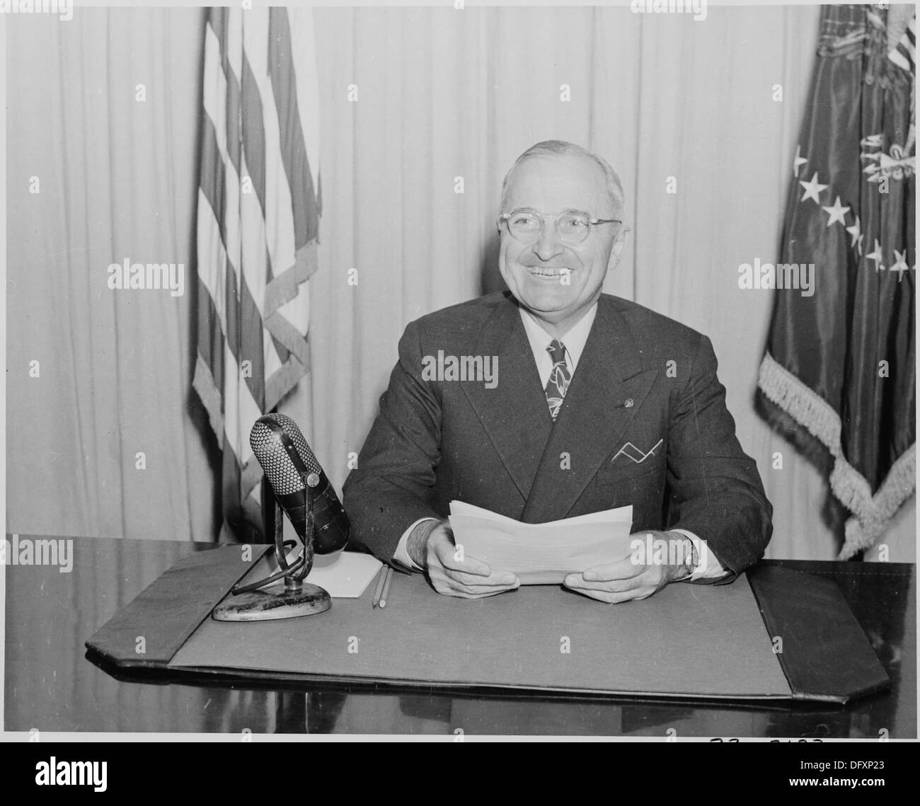 This photograph shows President Harry S. Truman smiling during his ...