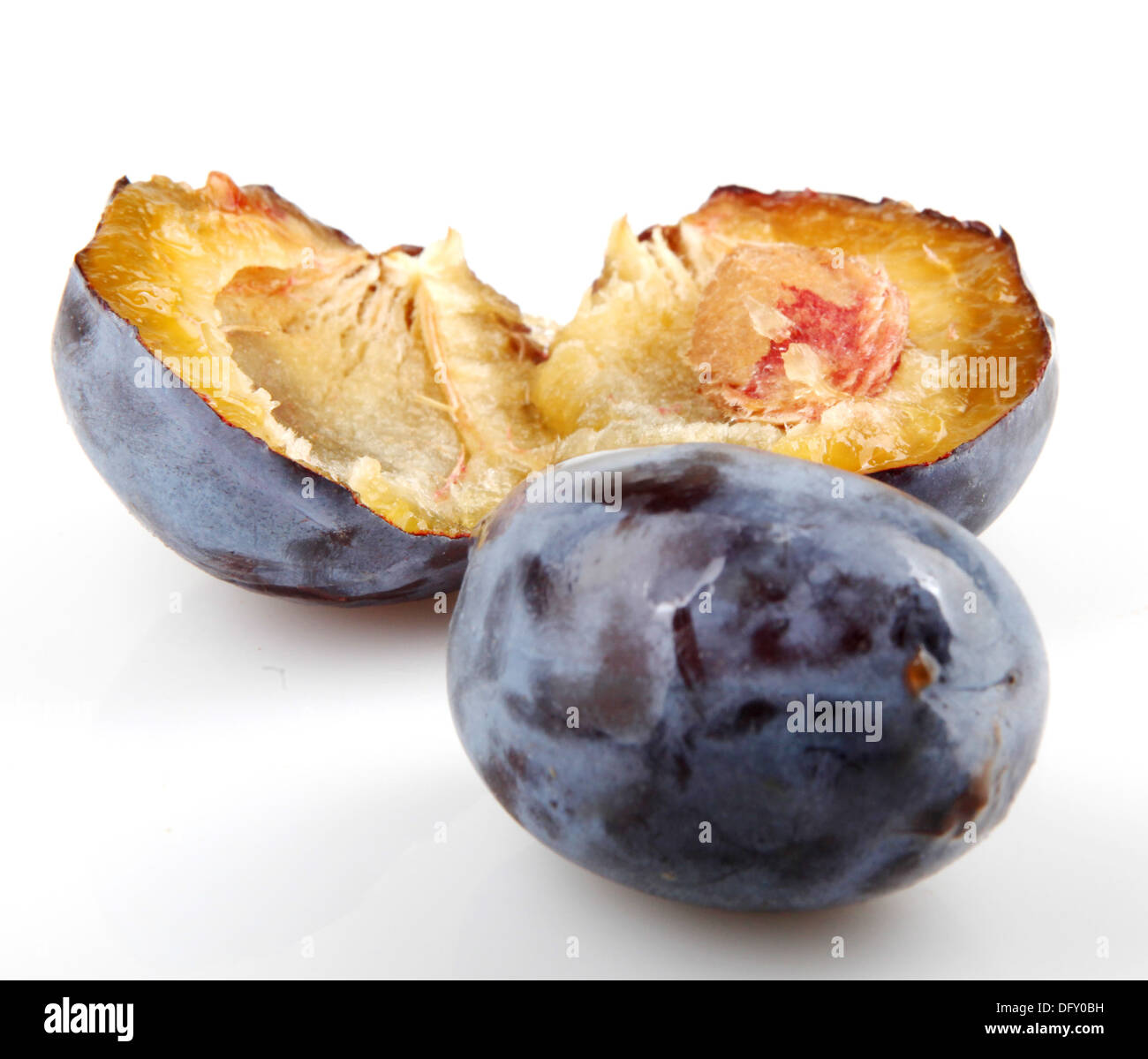 Plums On A White Background Stock Photo - Alamy