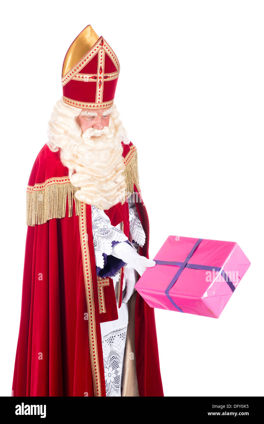Sinterklaas giving a present to a child, on a white background Stock ...