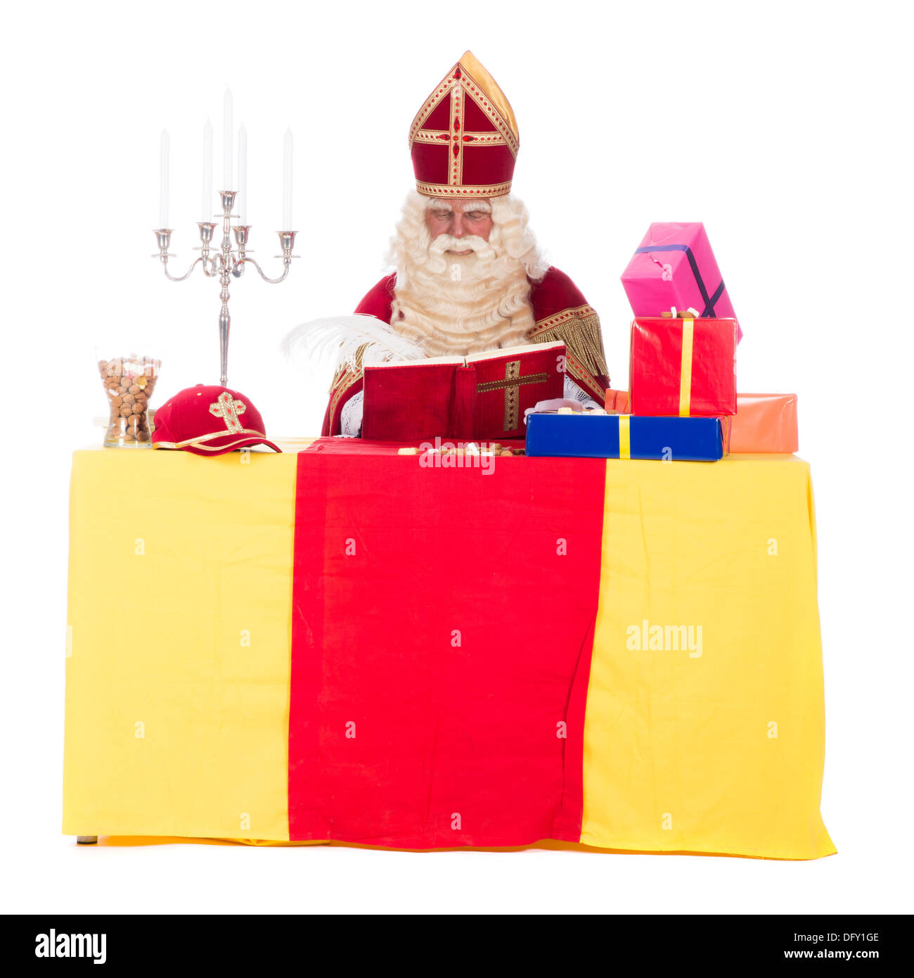 Sinterklaas is working at his desk, at a white background Stock Photo ...