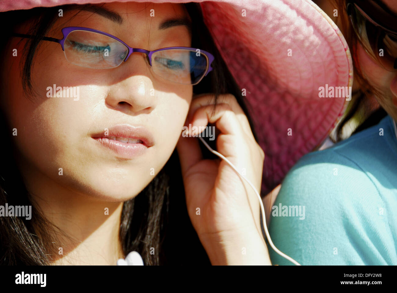 Held to ear hi-res stock photography and images - Alamy