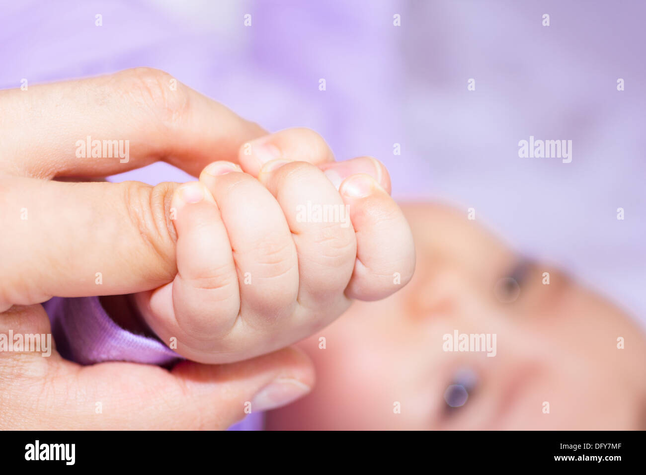 Baby hand holding mothers finger hi-res stock photography and images ...