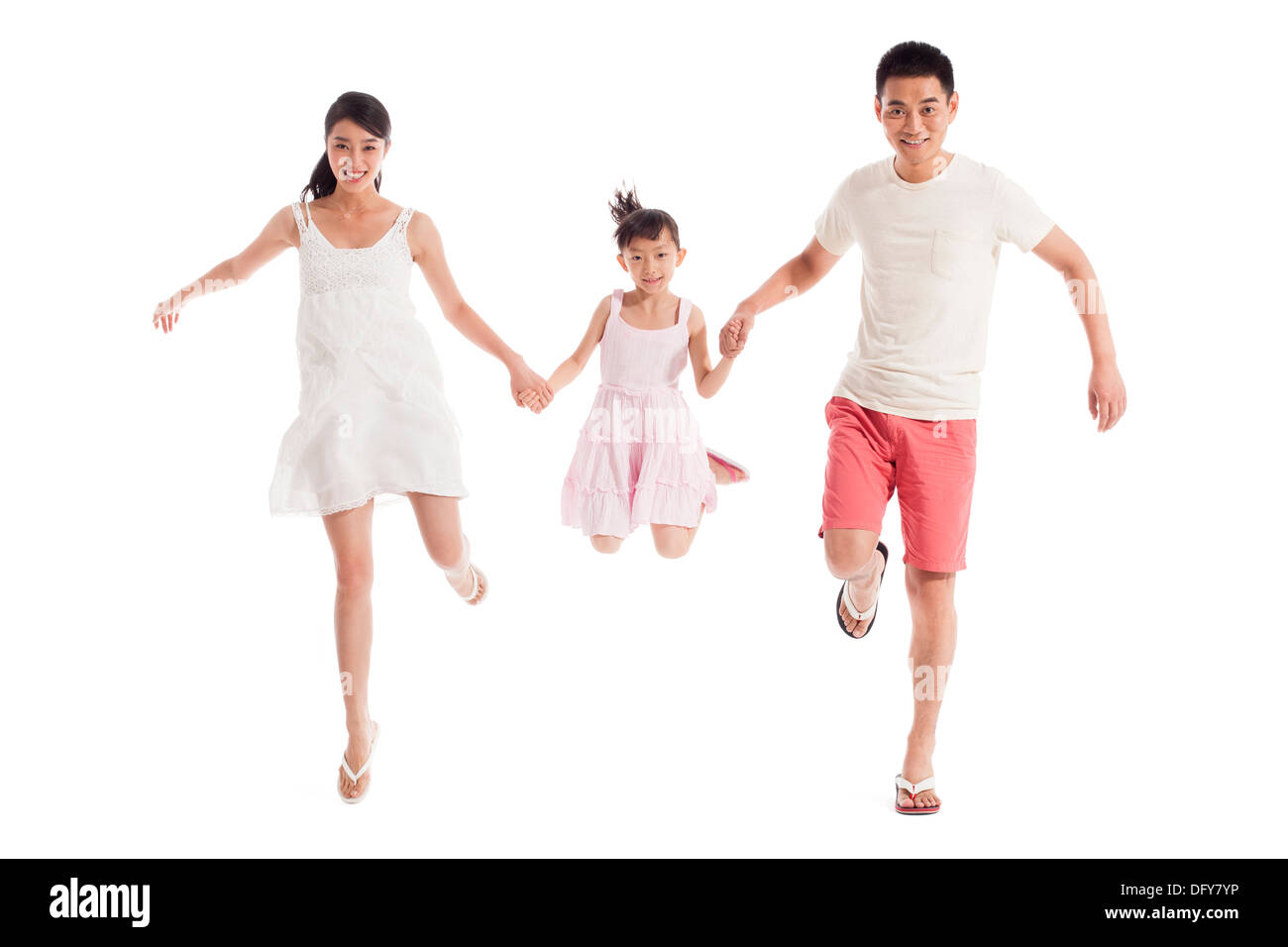 Happy family jumping Stock Photo - Alamy