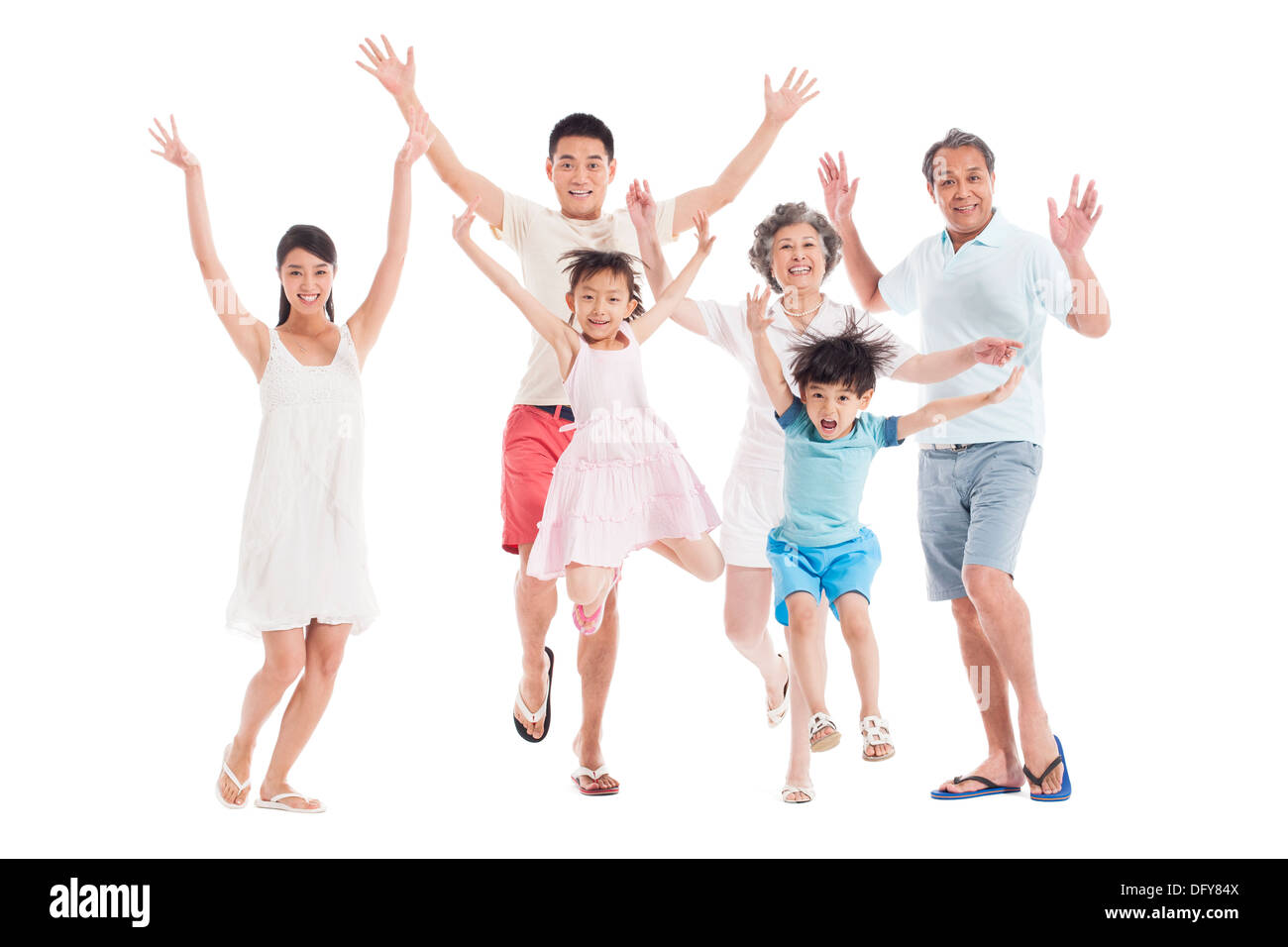 Happy family jumping and waving Stock Photo - Alamy