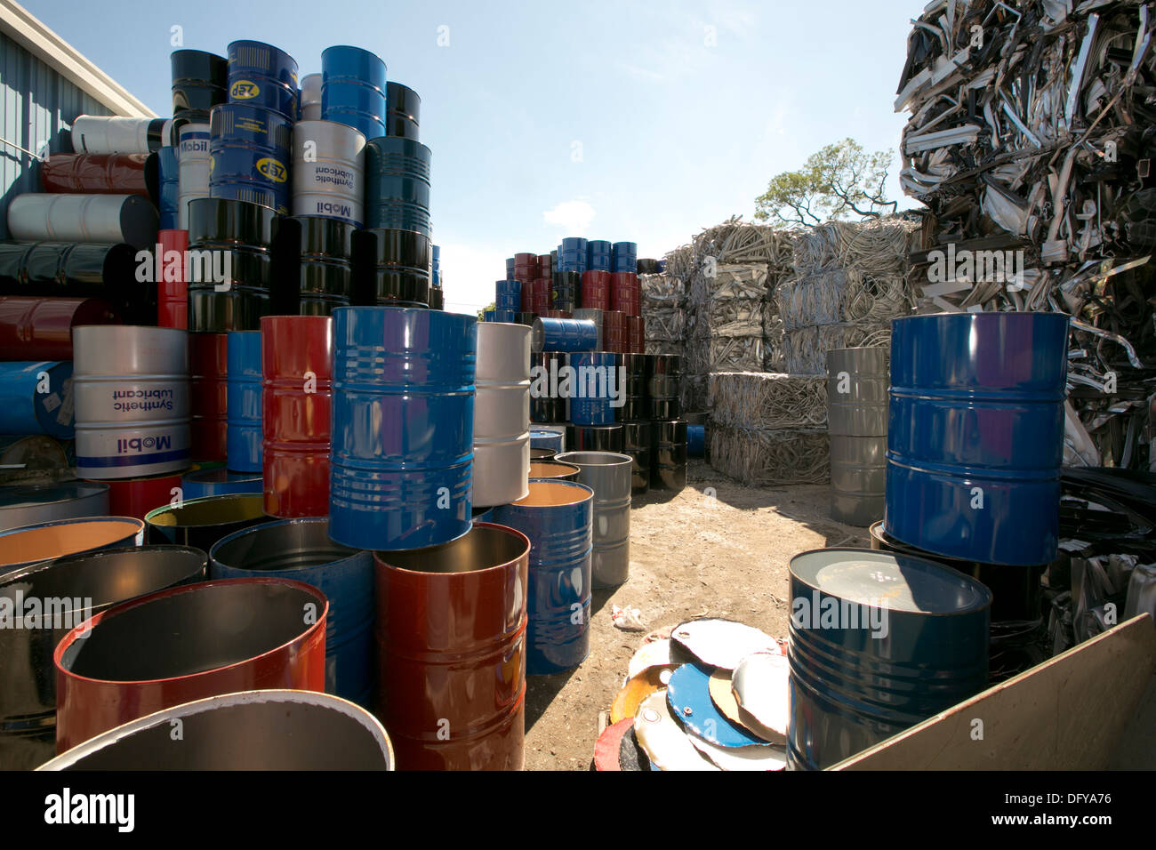 Metal oil barrels brought into scrap metal recycling yard in Texas ...